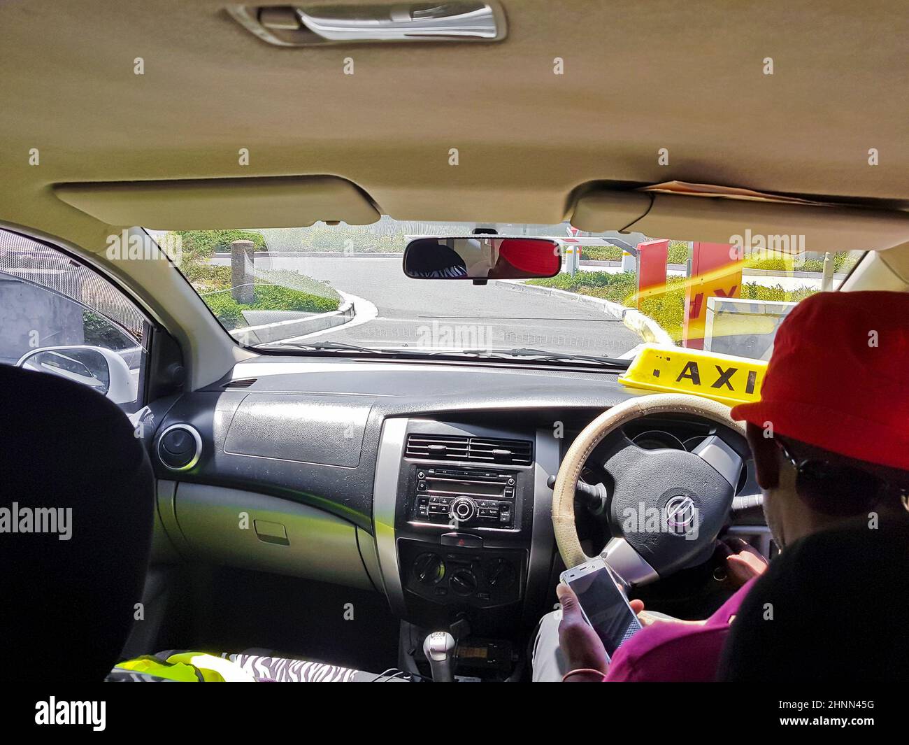 Taxi driver Cape Town, while driving in the back seat Stock Photo - Alamy