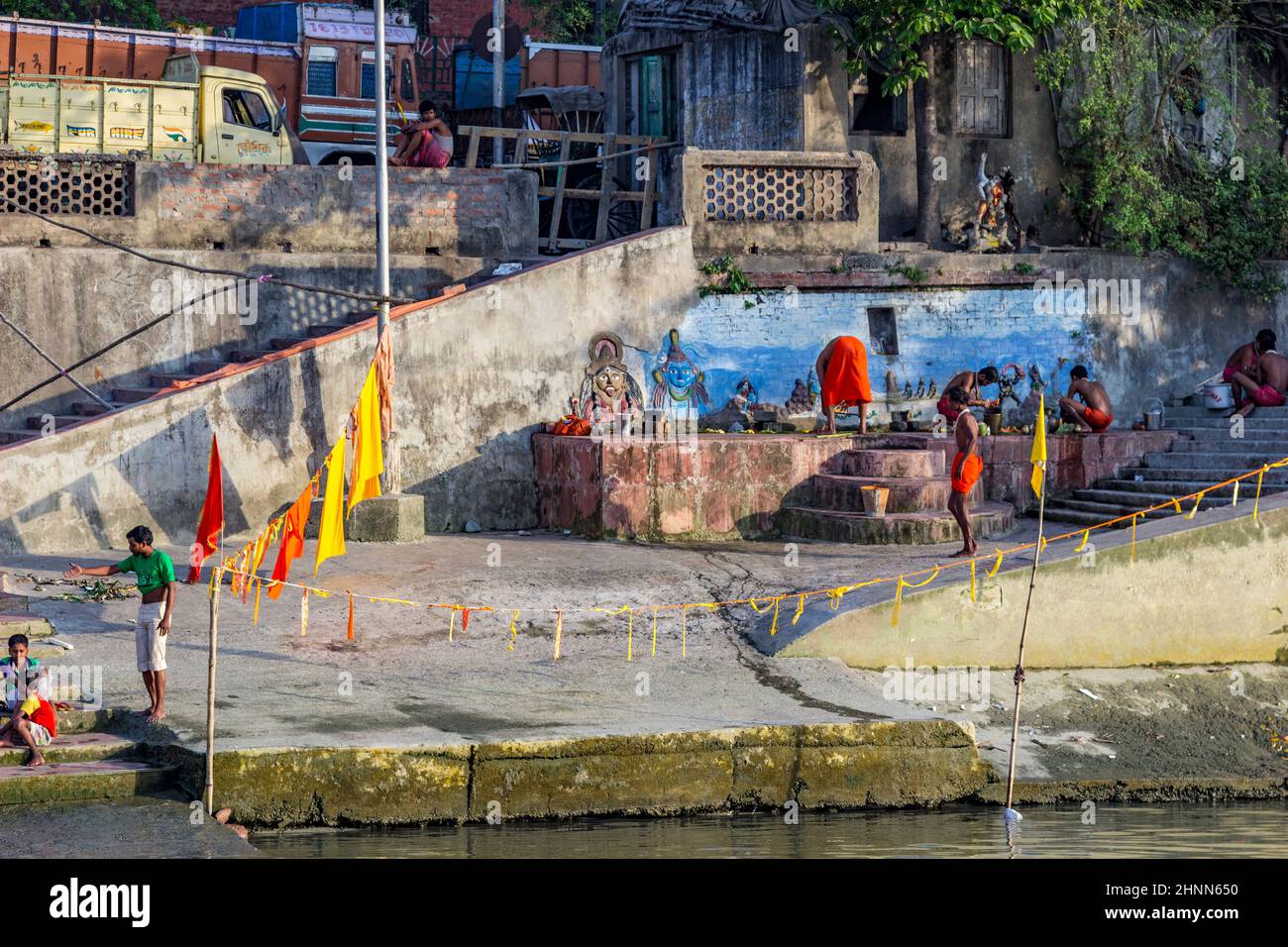 people cleaning clothes and washing in the river Ganges in Calcutta ...