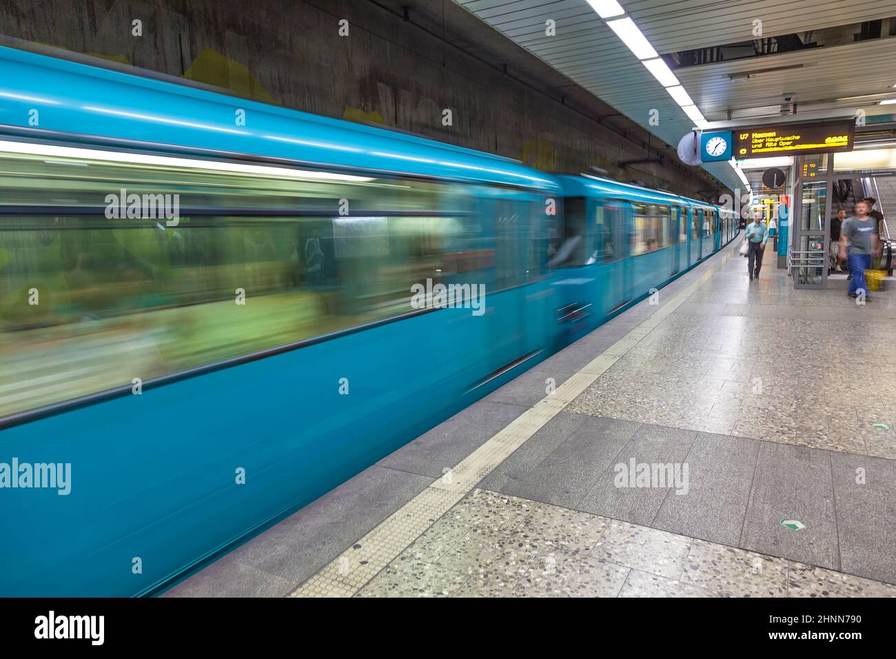 blue train arriving in Station Stock Photo - Alamy