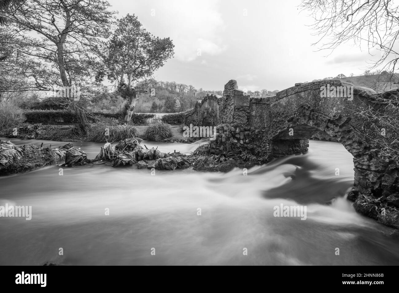 Long exposure of the river Avill flowing under Lovers bridge in the ...