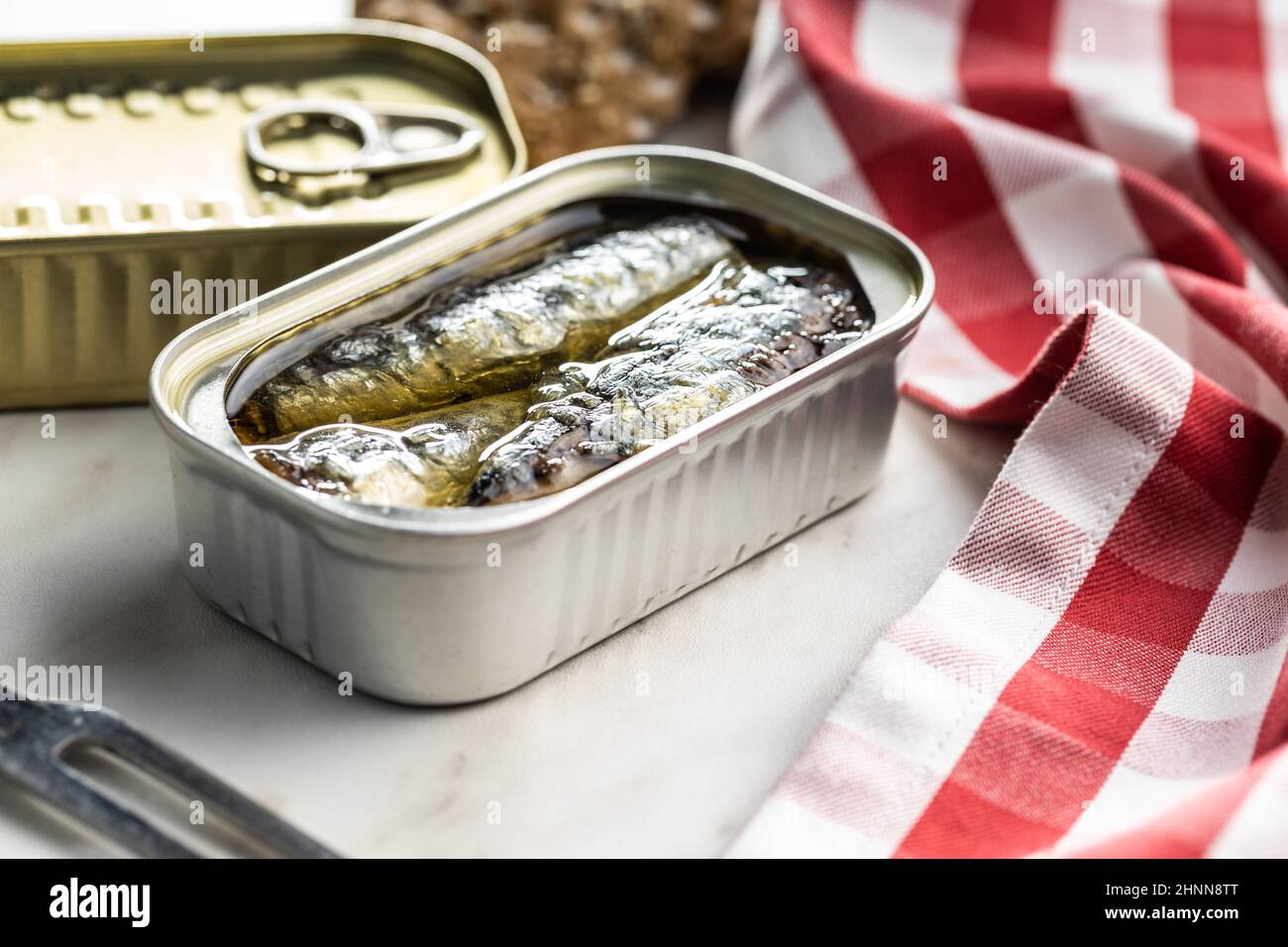 Canned sardines. Sea fish in tin can on kitchen table Stock Photo - Alamy