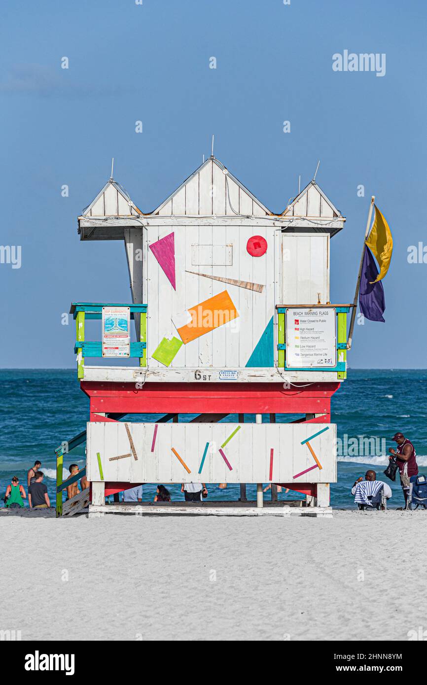 people enjoy south beach in Miami Beach and sit in front of the ...