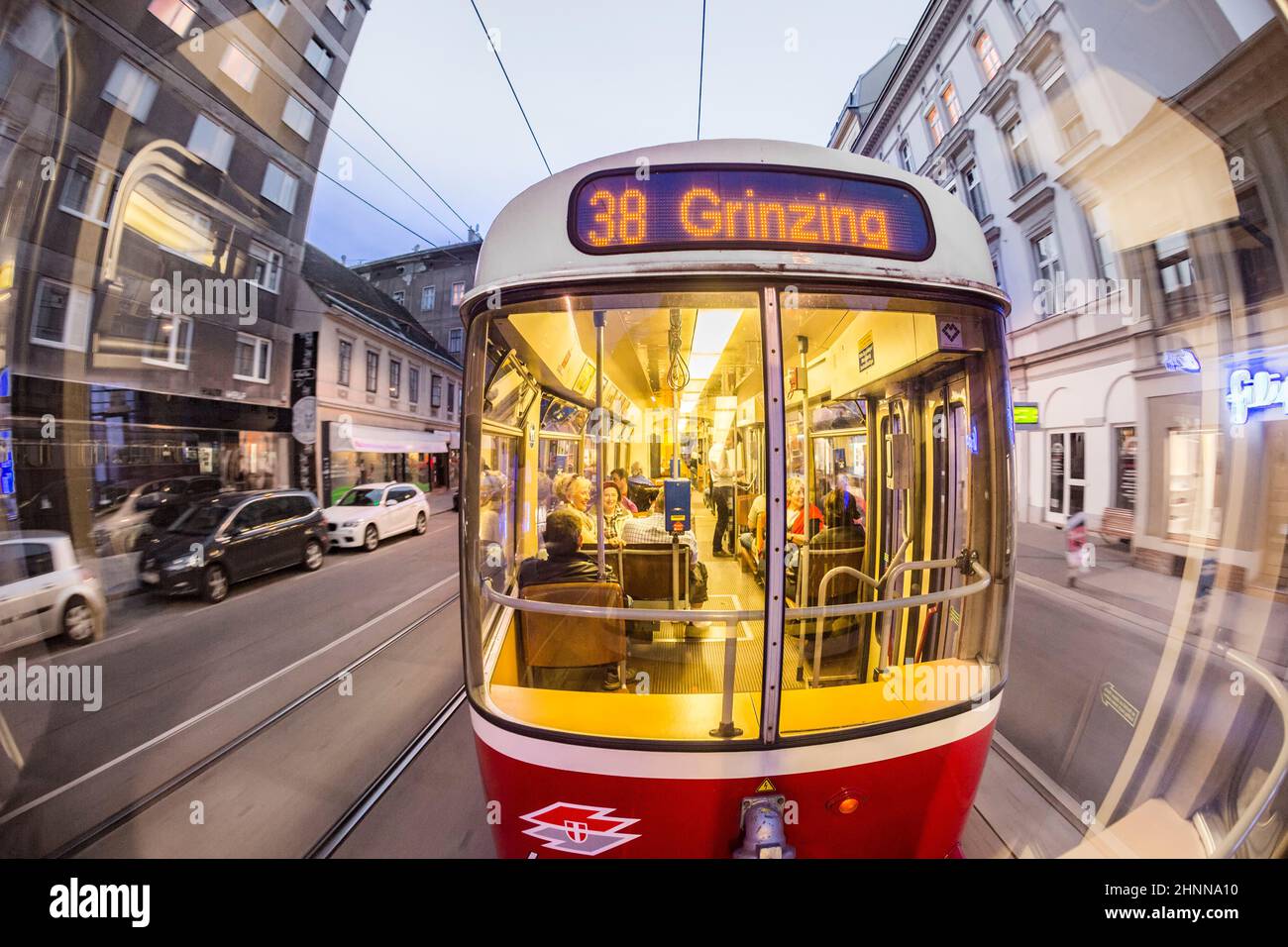 Old fashioned tram by a night ride Stock Photo - Alamy