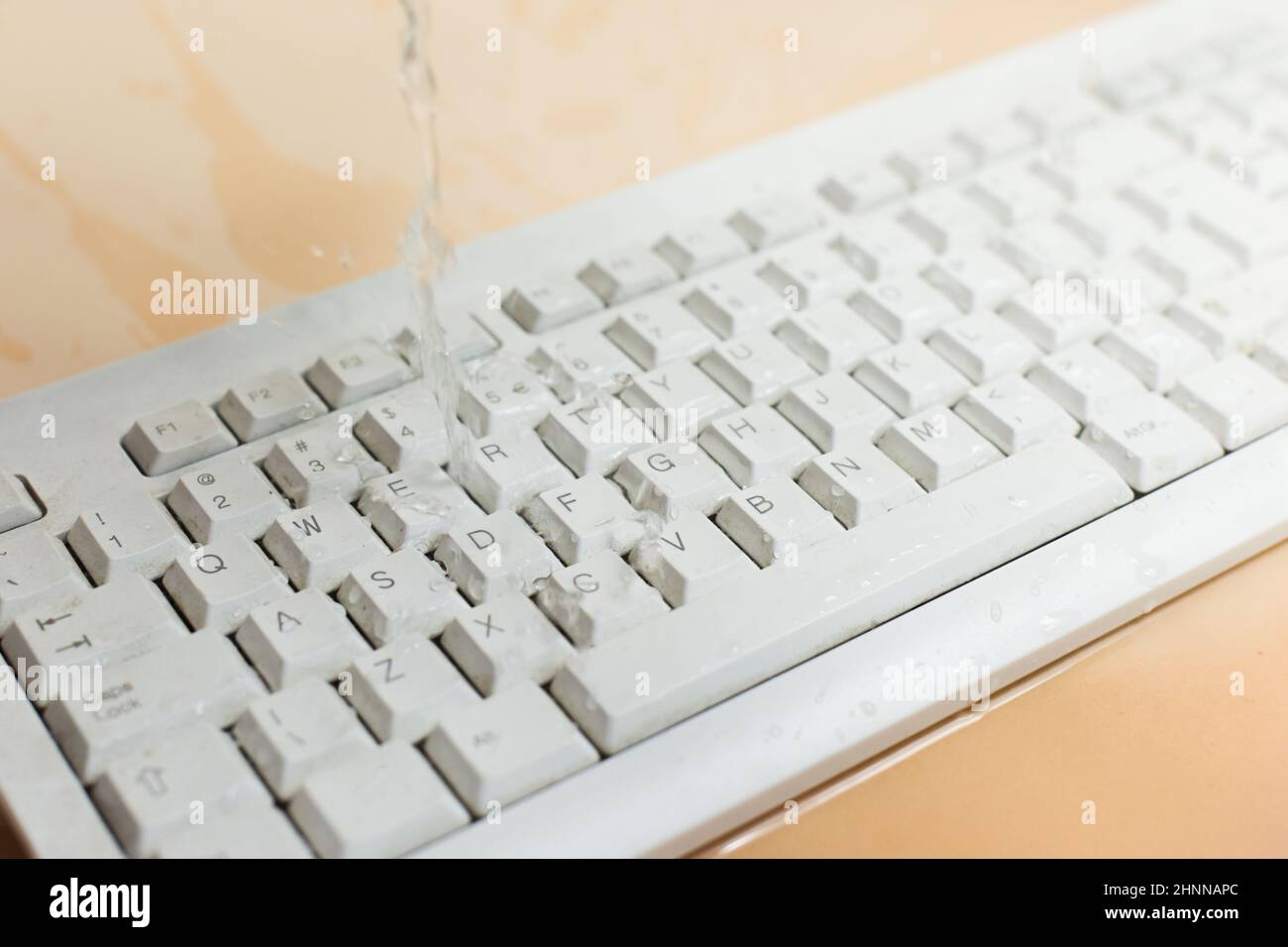Keyboard in the water, waterproof keyboard, spilled water on the ...