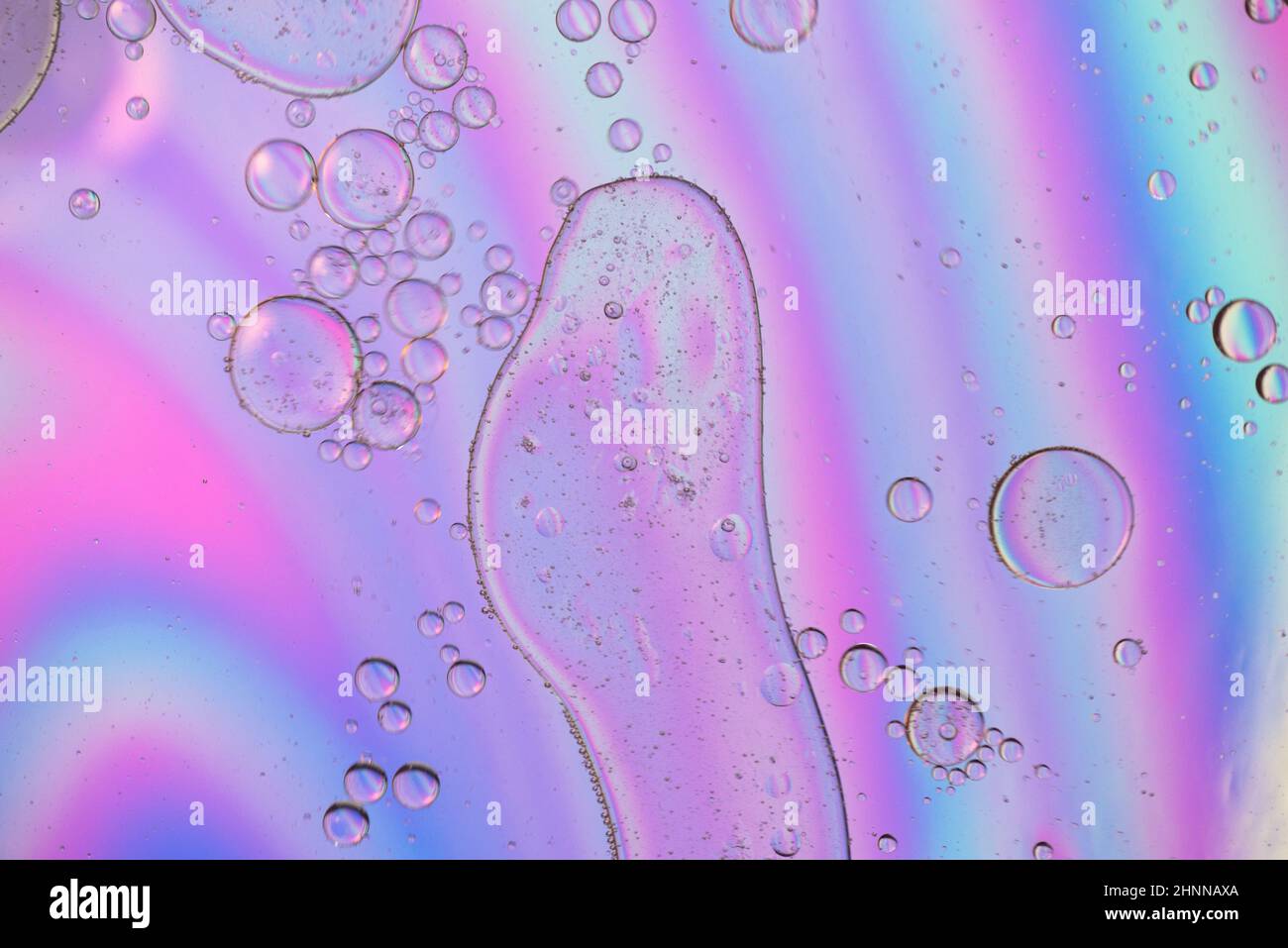 Oil drops in water. Abstract psychedelic pattern image holographic ...