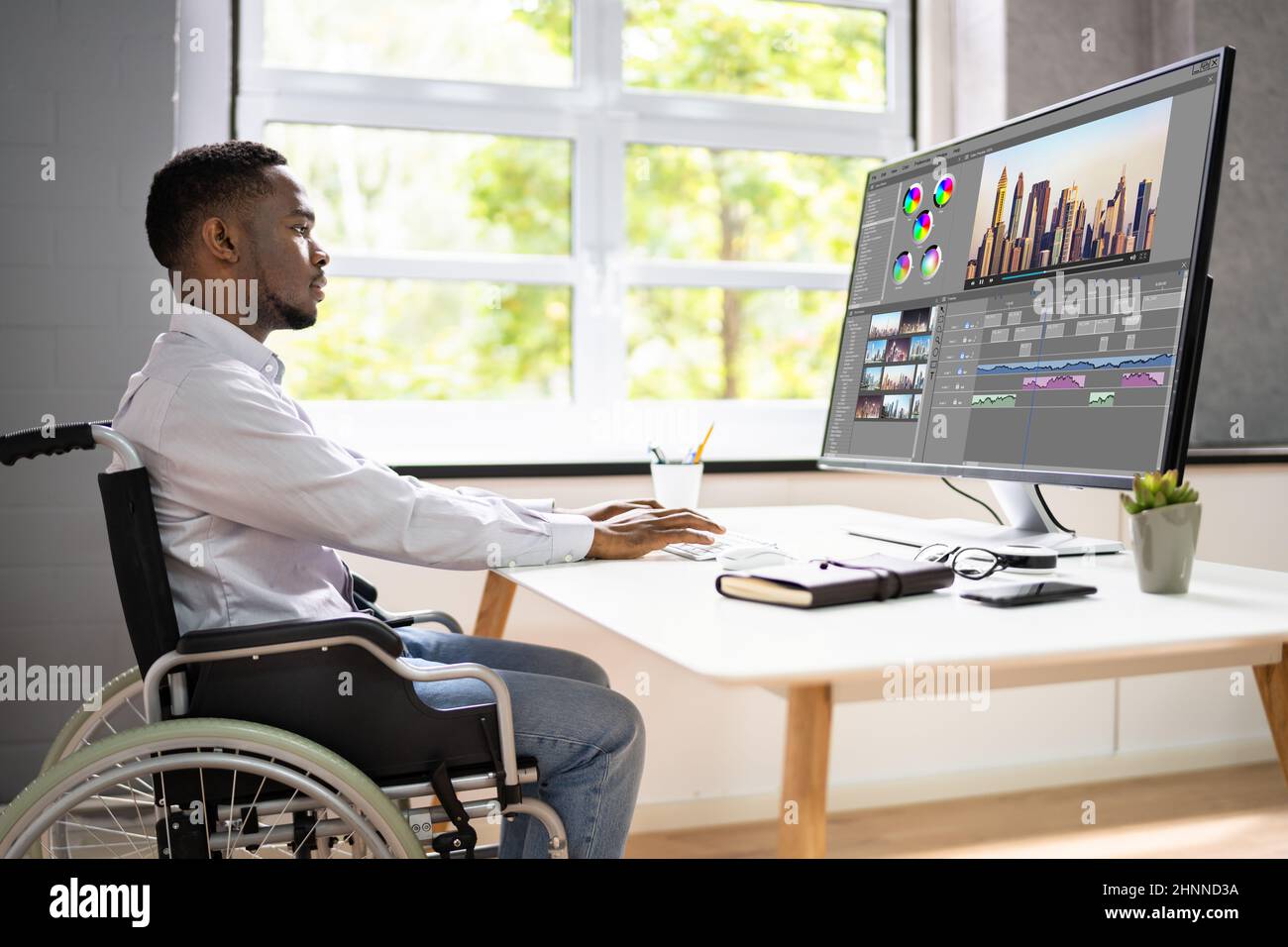 African American Video Editor Tech Job Using Computer Stock Photo - Alamy