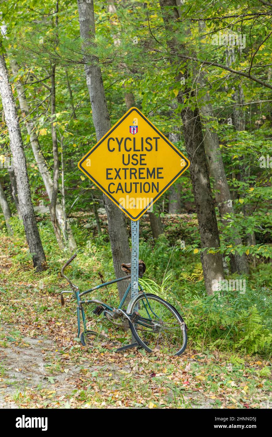 sign cyclist use extreme caution in the forest to warn bikers Stock ...