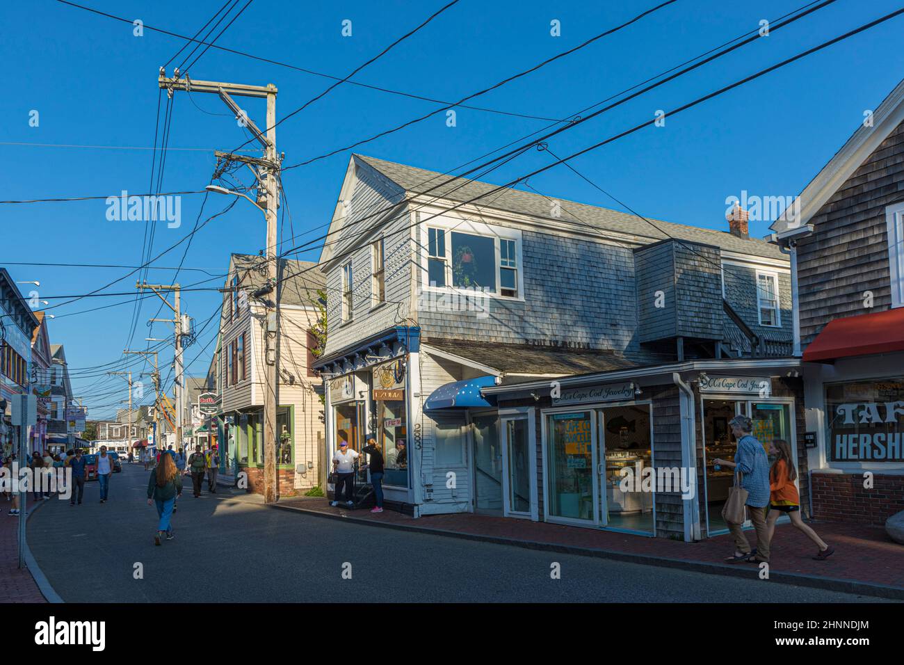 people enjoy a warm summer day in the historic part of Provincetown ...