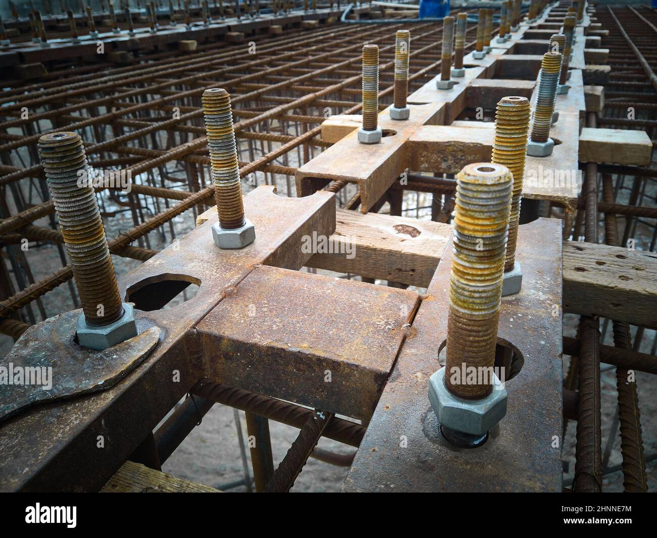 Rows of anchor bolts Stock Photo - Alamy
