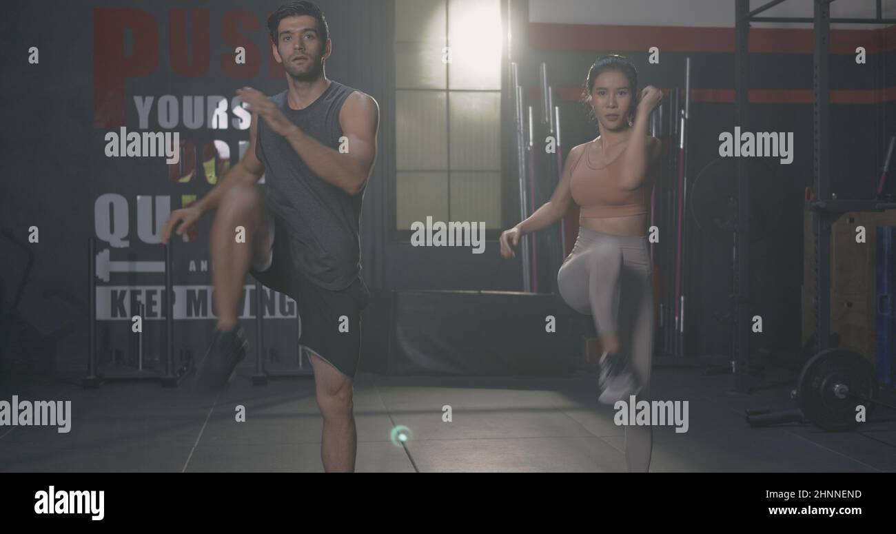Two Muscular young Caucasian man and Asian woman doing laughing ...