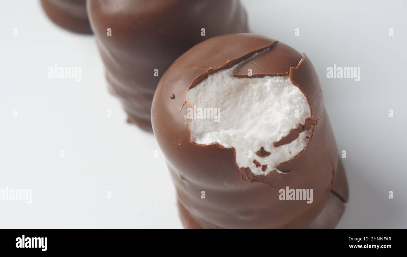 White Chocolate Krembo on the table. A chocolate-coated marshmallow ...