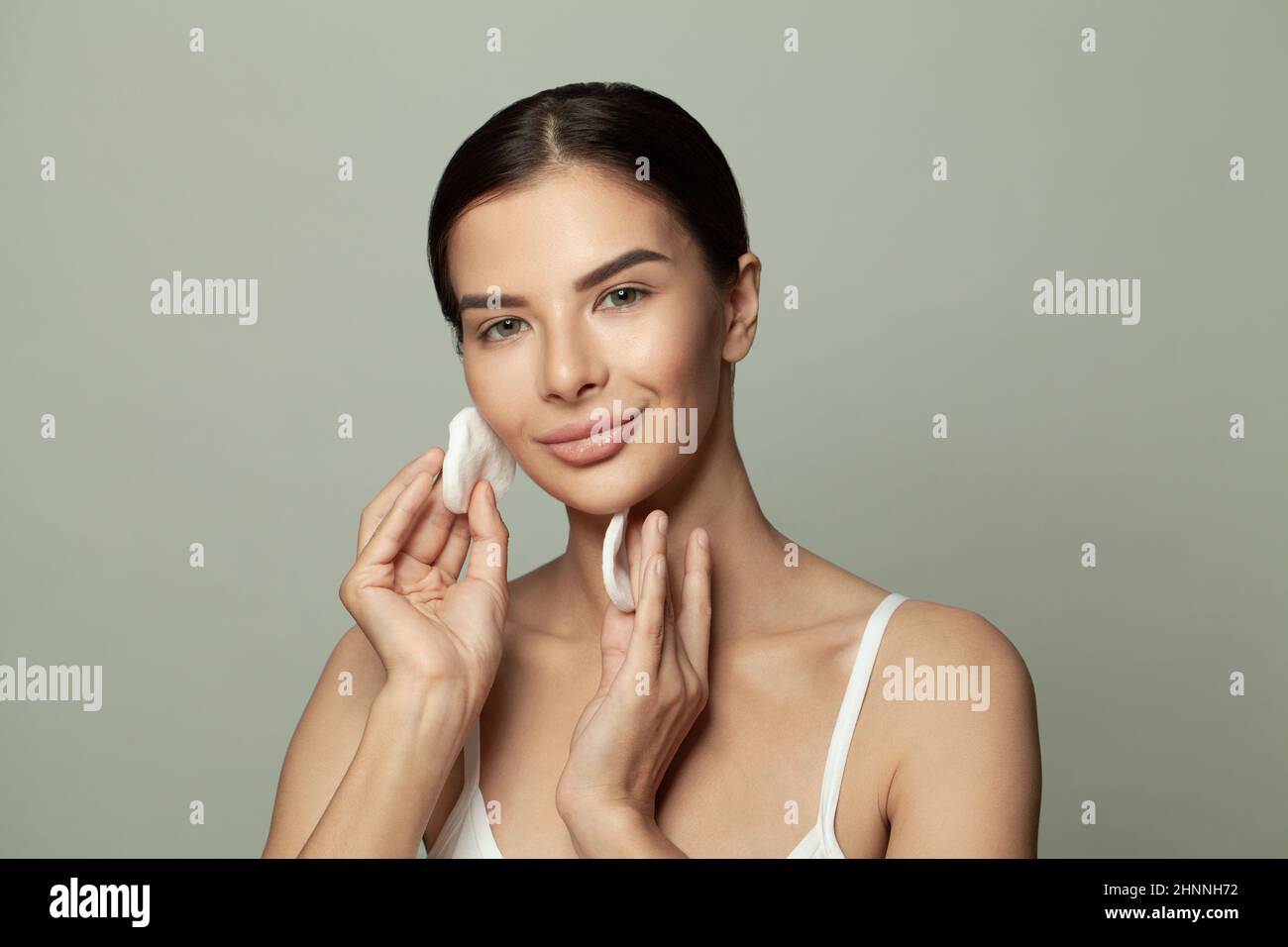 Perfect woman model with a sponge on gray background. Female with ...