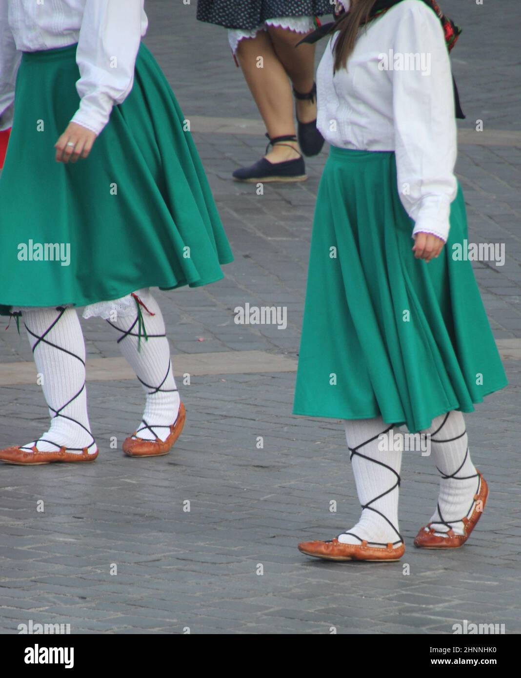 Photo of young girls wearing costume clothes and performing Basque folk ...