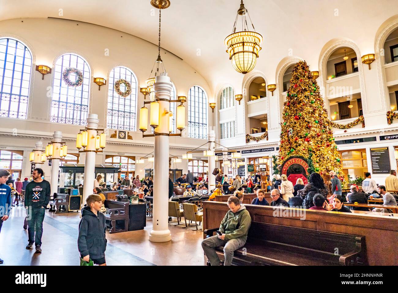 people relax and wait for train inside of historic Union Station in ...