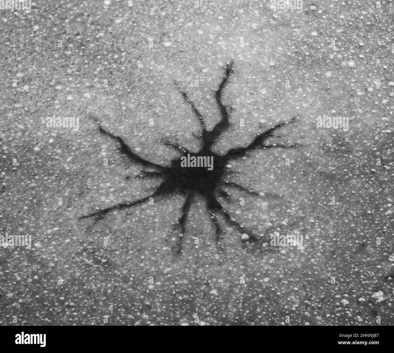 Crack in ice with hole hi-res stock photography and images - Alamy