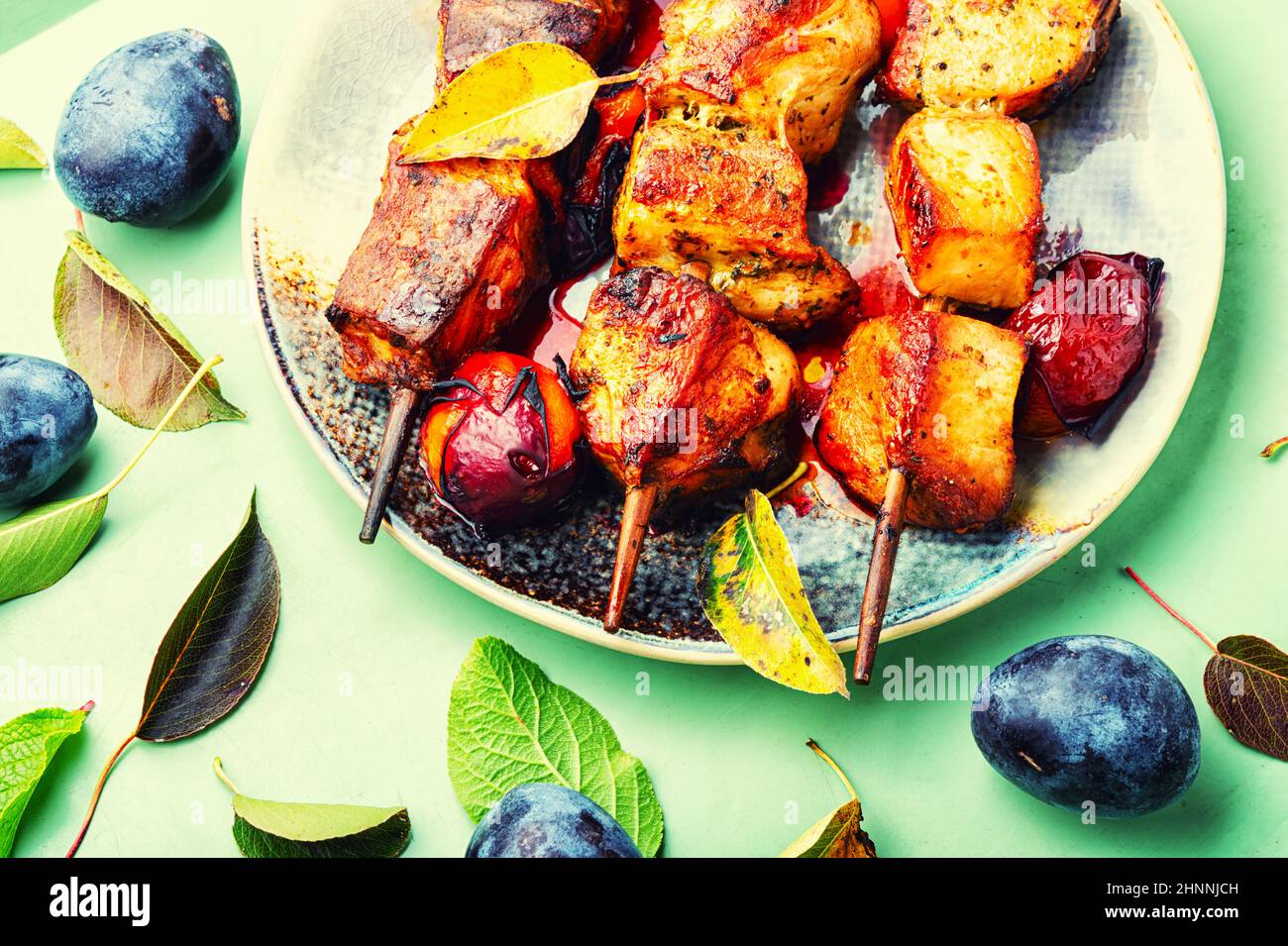 Fried meat on wooden stick,kebabs in plum sauce.Pork barbecue Stock ...