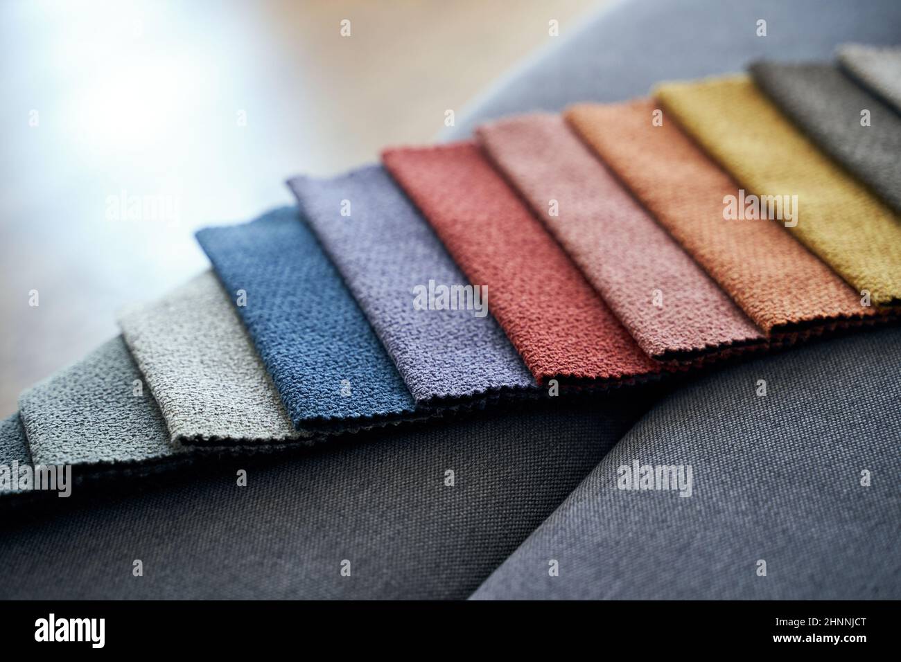 Colorful upholstery fabric samples on the home sofa Stock Photo - Alamy