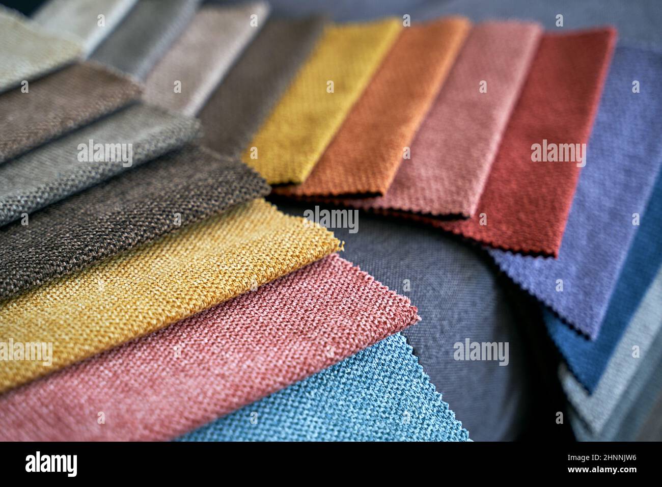 Colorful upholstery fabric samples on the home sofa Stock Photo - Alamy