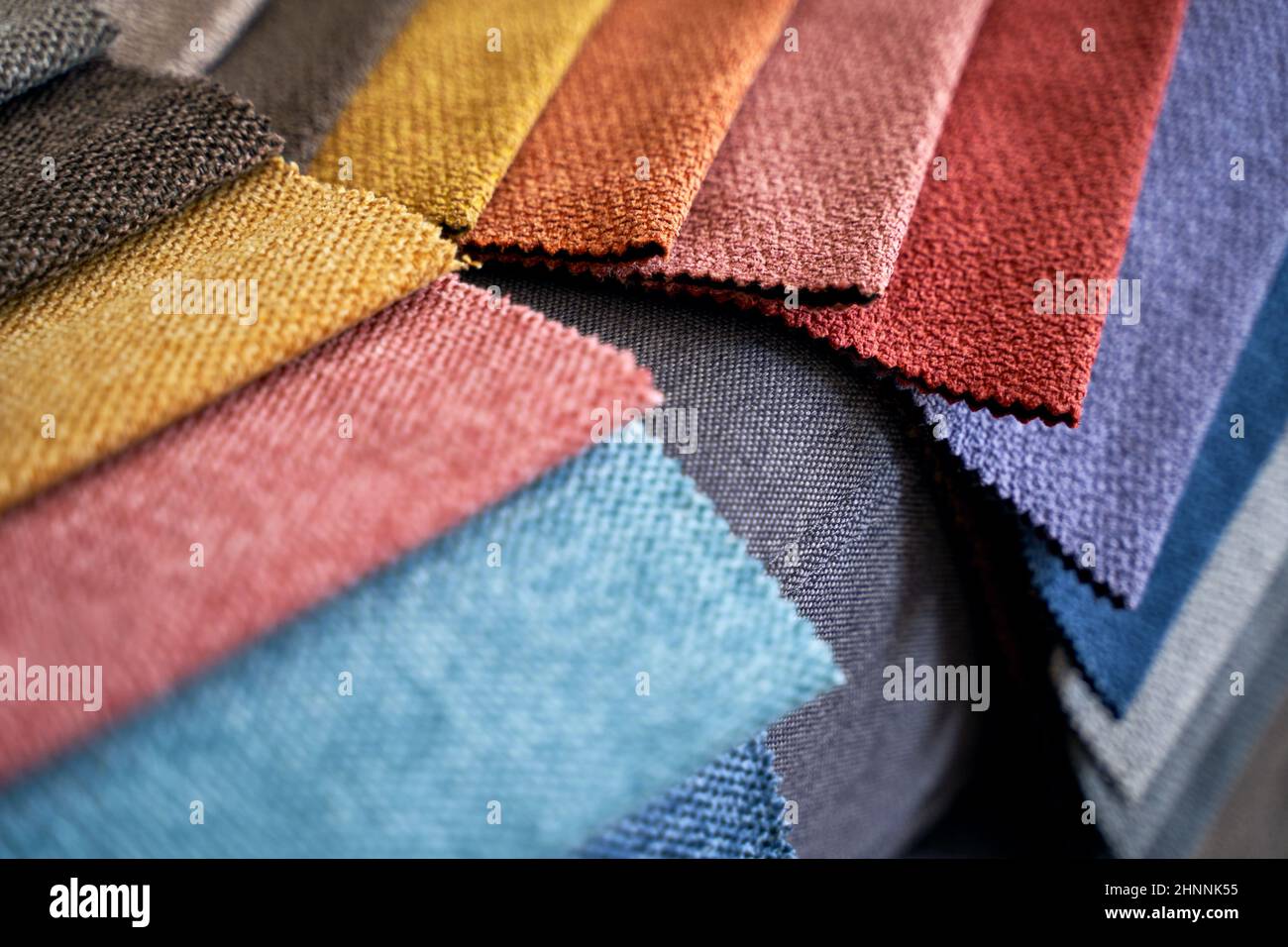 Colorful upholstery fabric samples on the home sofa Stock Photo - Alamy