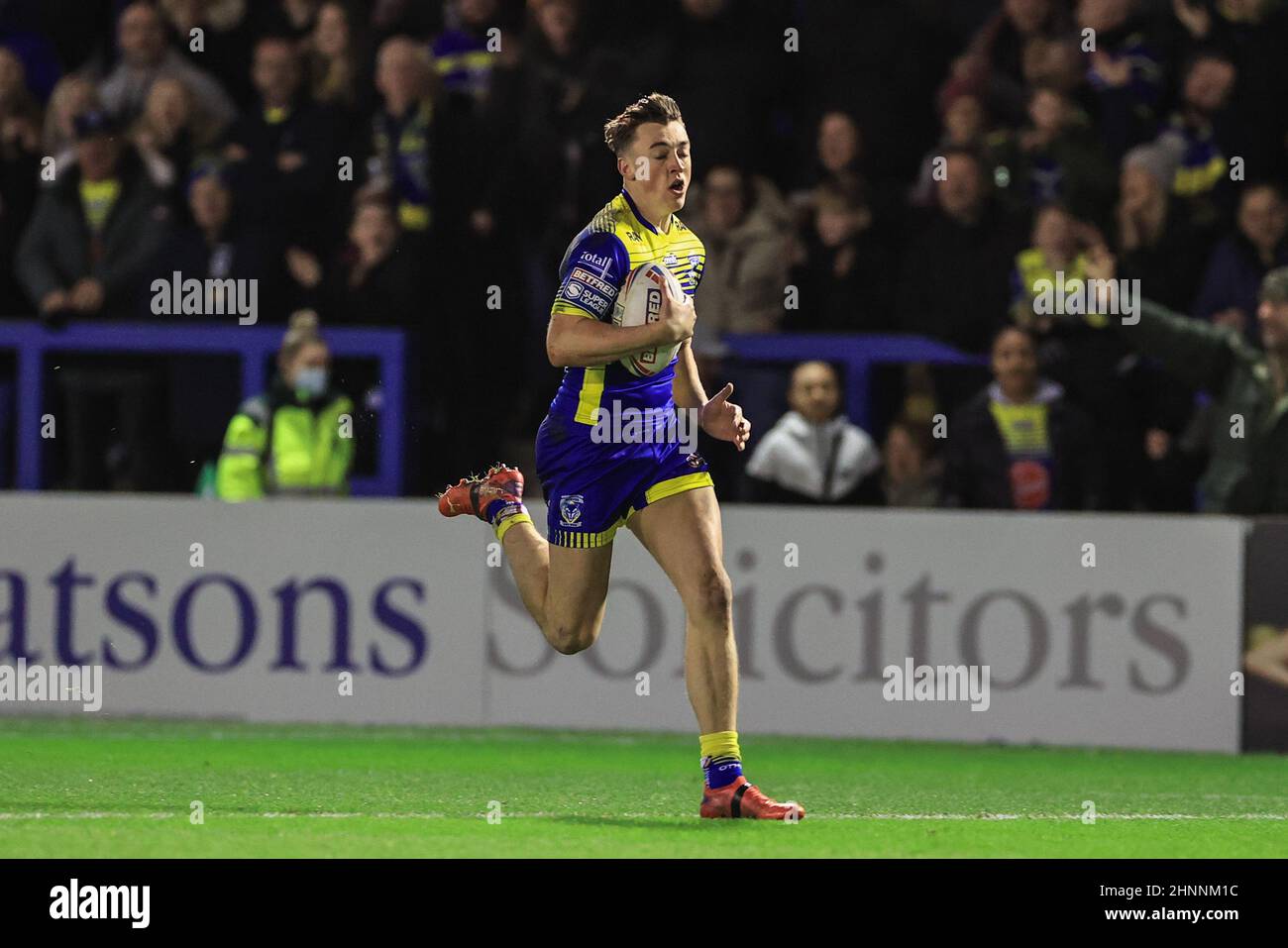 Matty Ashton #5 of Warrington Wolves makes a 60 yard solo dash to go ...