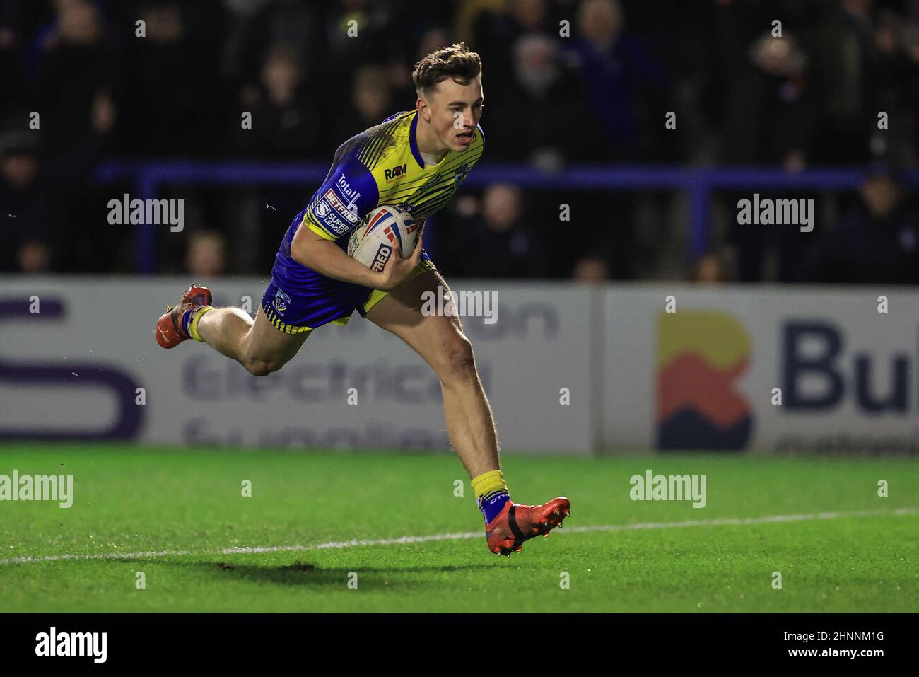 Matty Ashton #5 of Warrington Wolves makes a 60 yard solo dash to go ...