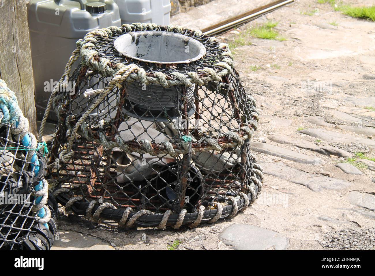 A Traditional Fishing Pot on a Harbour Wall Side Stock Photo - Alamy