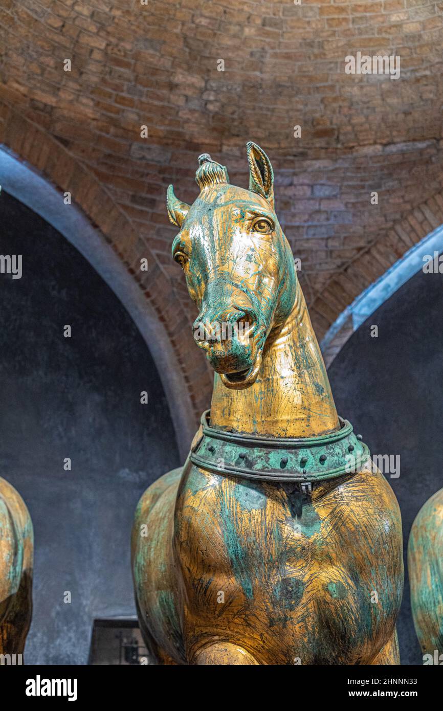 Ancient bronze horses inside the Basilica di San Marco in Venice. Famous quadriga from ...