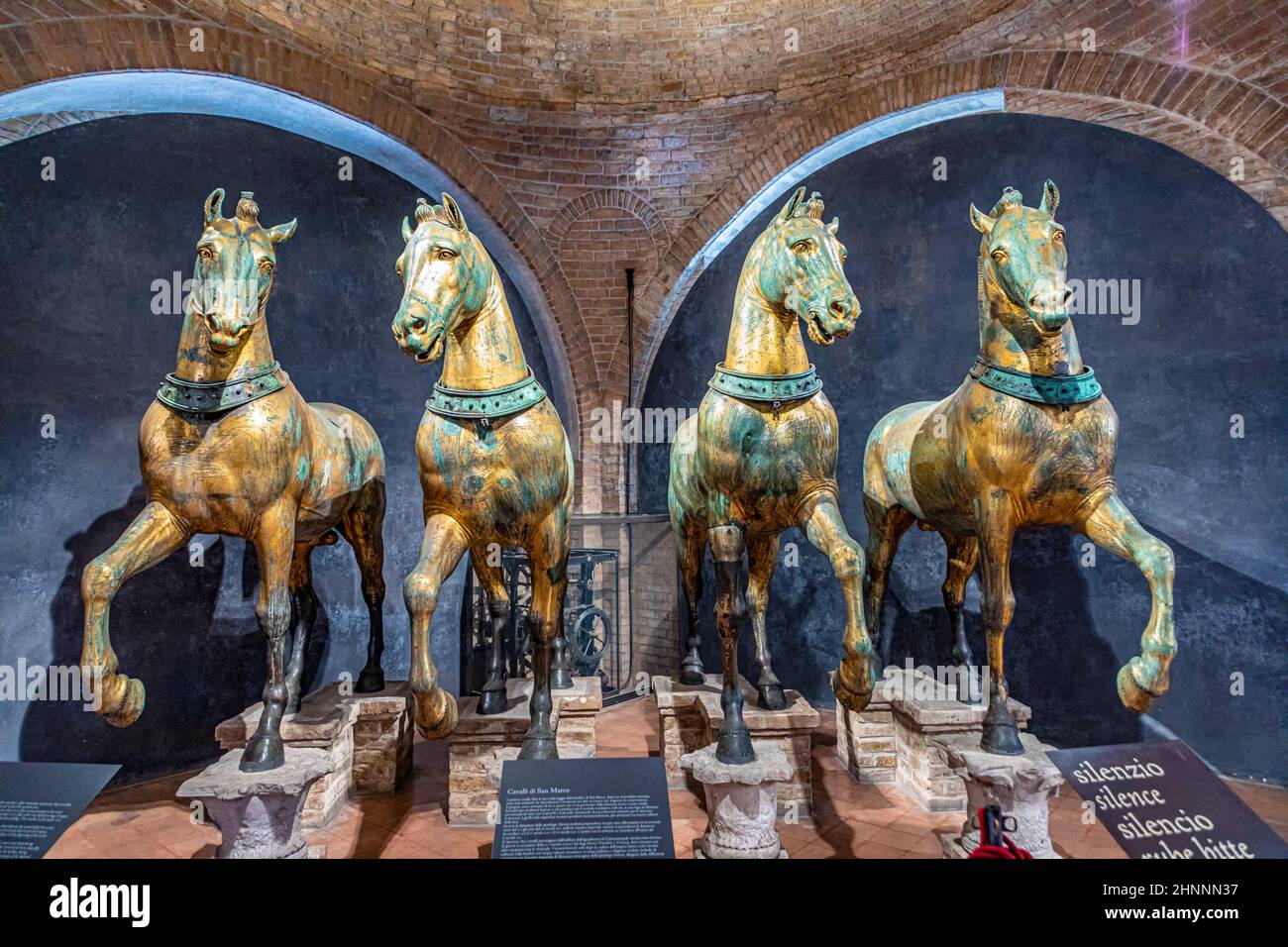 Ancient bronze horses inside the Basilica di San Marco in Venice. Famous quadriga from ...