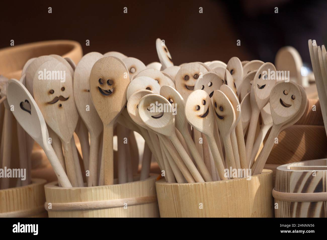 Decorated wooden spoons on the market Stock Photo - Alamy