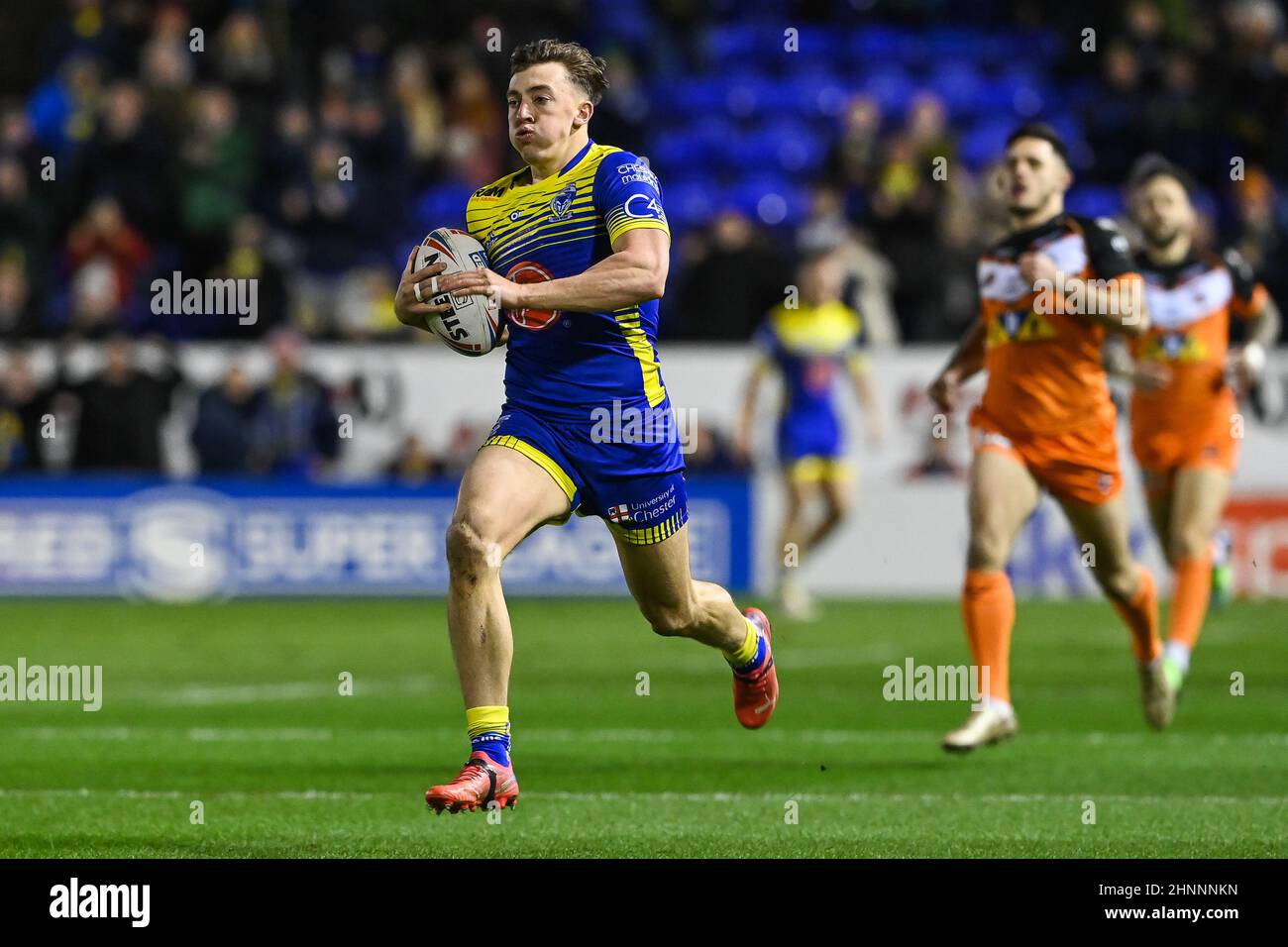 Matty Ashton #5 of Warrington Wolves makes a break for a try Stock ...