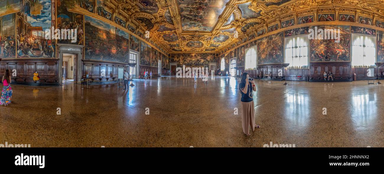 chamber of the great council at the Doge Palace with tourist. Ceiling ...