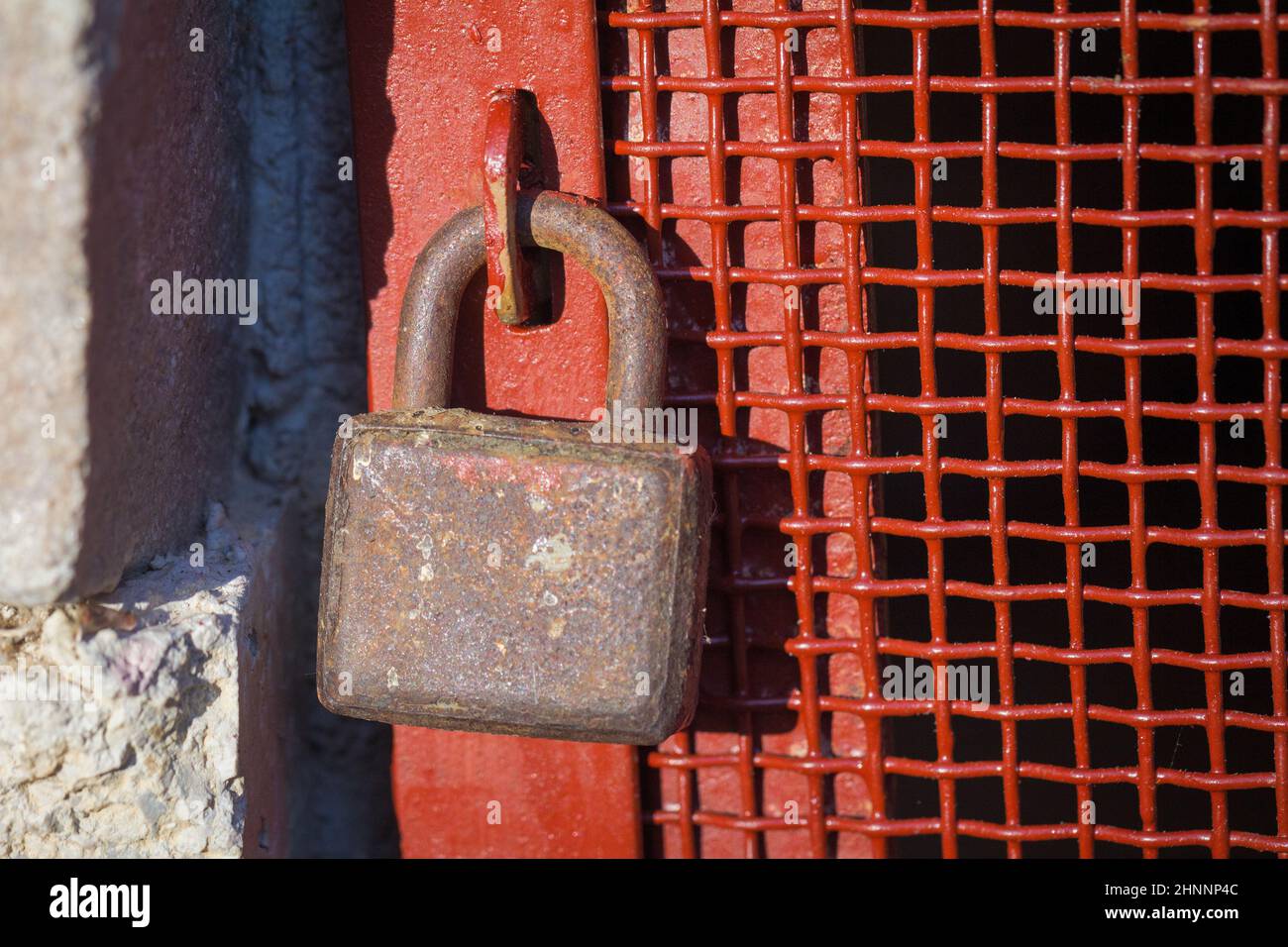 Old rusty padlock on an iron door Stock Photo - Alamy