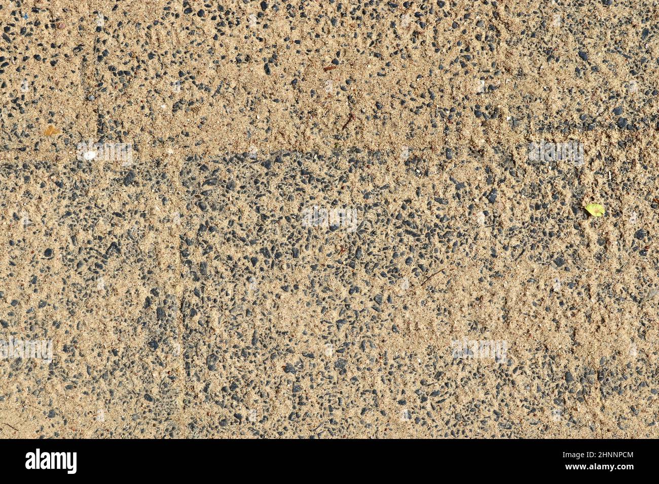 Detailed close up view on a brown sand ground texture in high ... Detailed close up view on a brown sand ground texture in high ...
