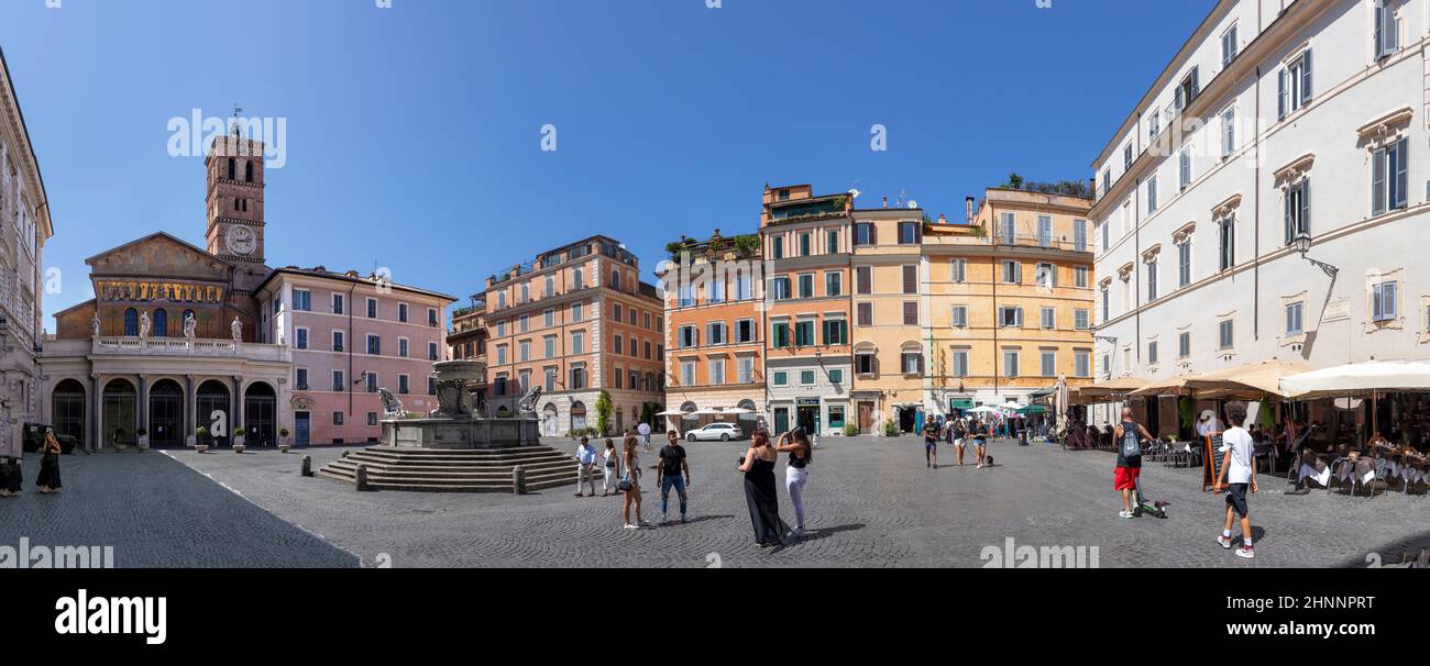 people at Piazza di Santa maria with fountain and church Santa Maria in ...