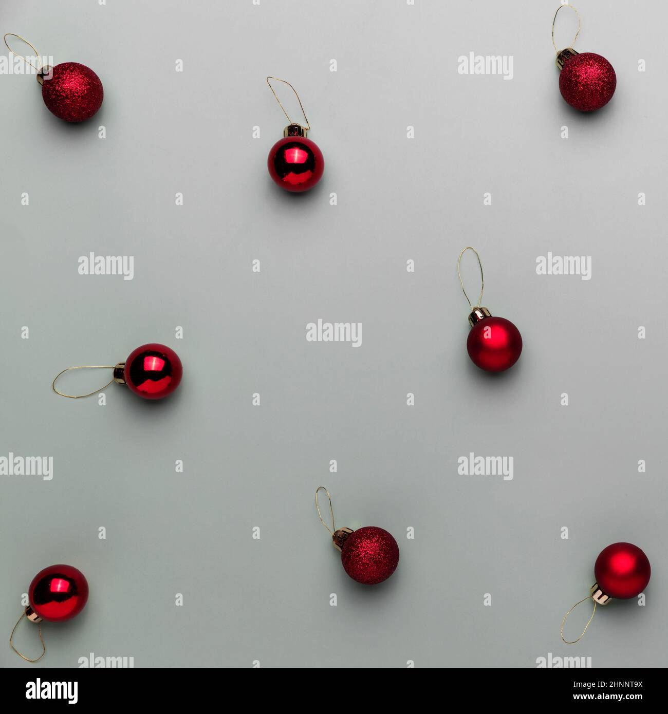 Pattern on gray background with small red Christmas balls or sphere ...