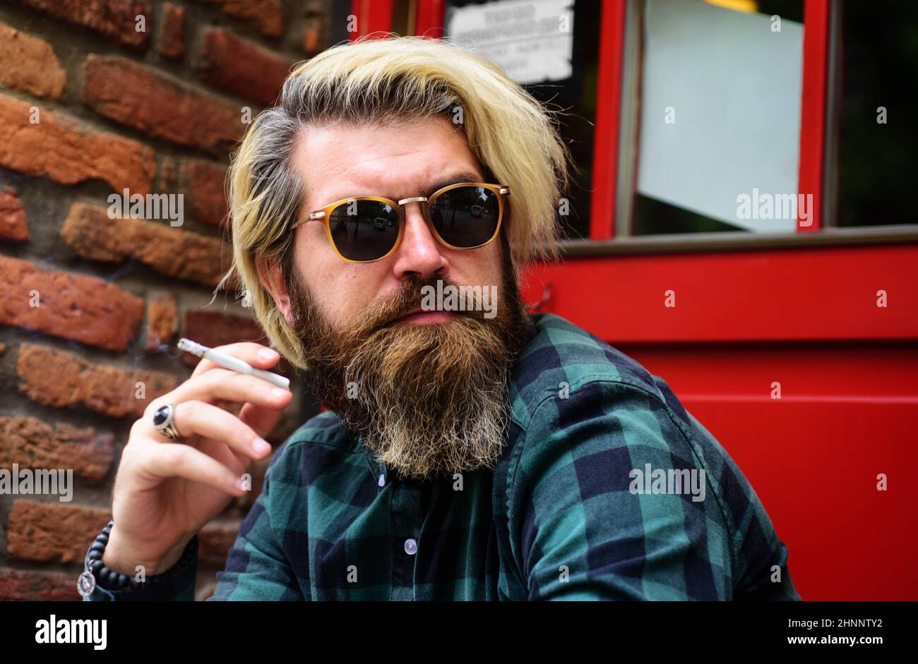 Bearded Man with cigarette. Closeup portrait of smoking guy. Handsome ...