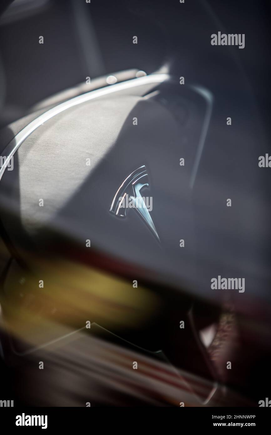 Tesla logo on a steering wheel Stock Photo - Alamy
