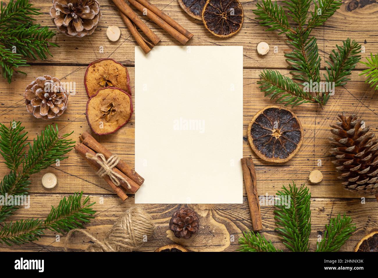 Winter Christmas Composition with a blank card over wooden table flat ...