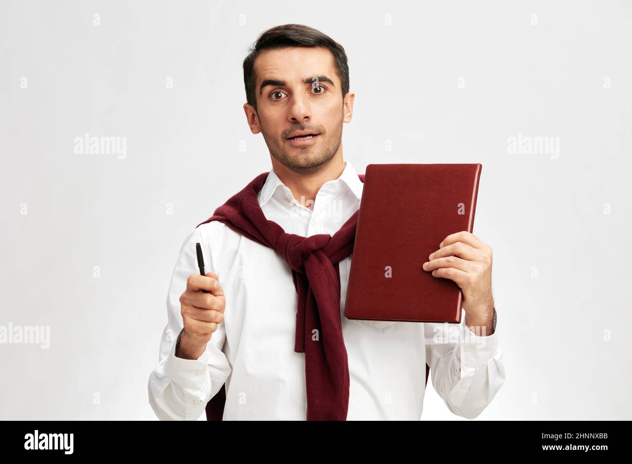 man notepad with pen emotions education light background Stock Photo ...