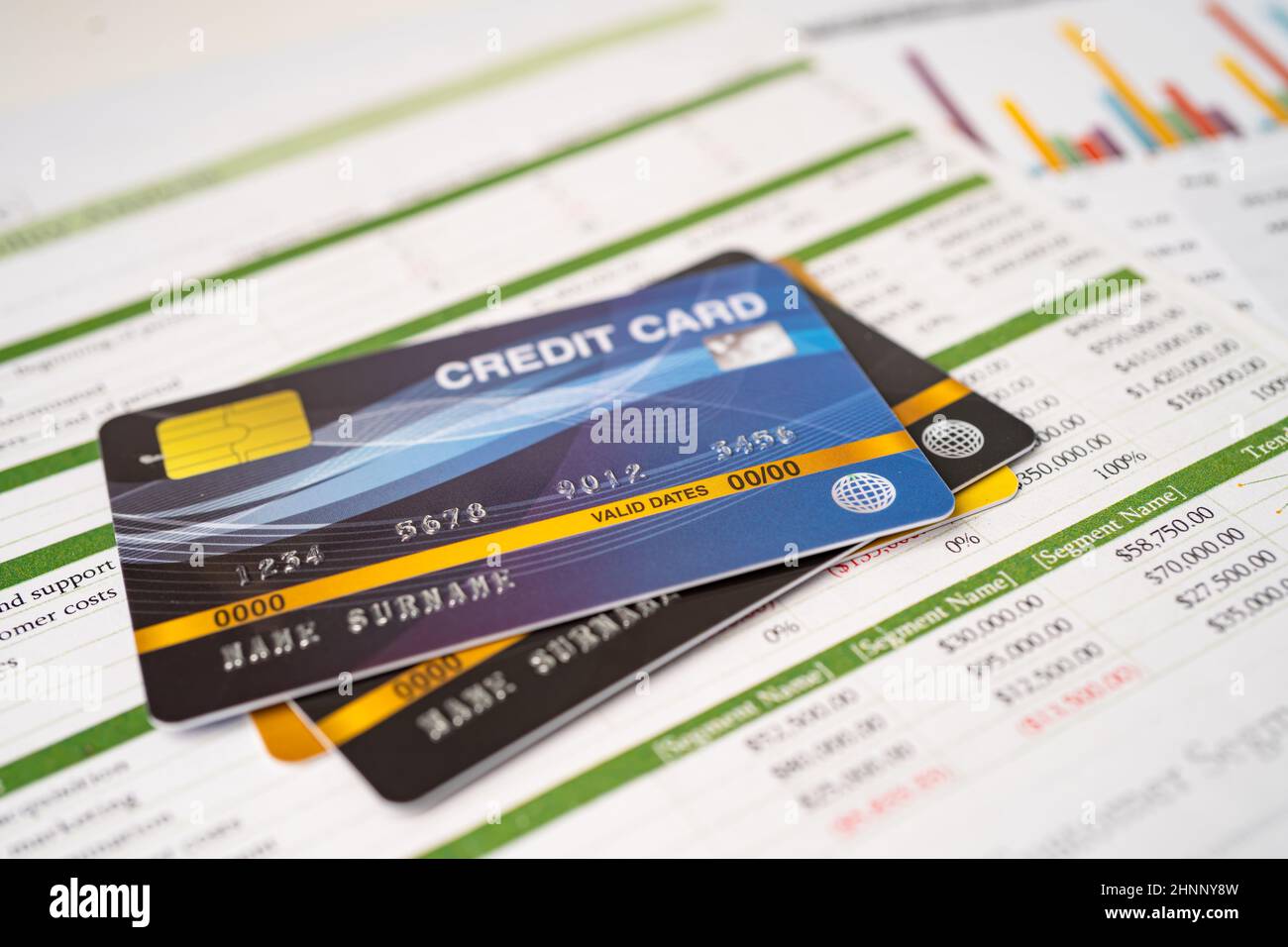 Credit card on chart and graph spreadsheet paper. Finance development ...