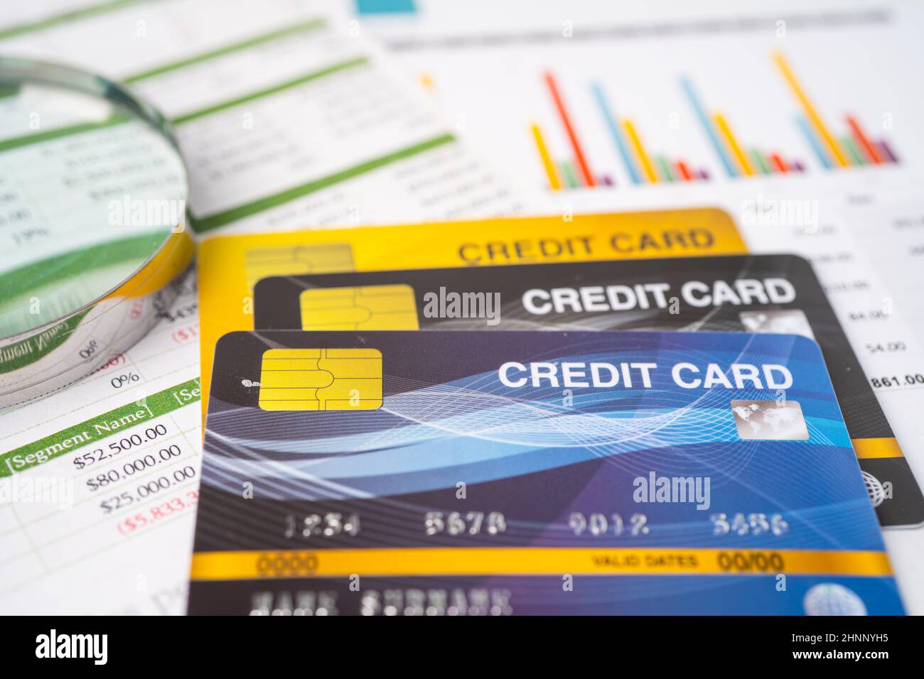 Credit card model with Magnifying glass, Financial development ...