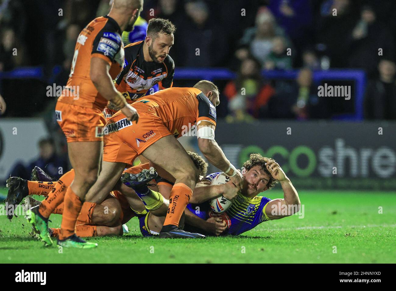Warrington, UK. 17th Feb, 2022. Rob Mulhern #19 of Warrington Wolves is tackled by Liam Watts #8 ...