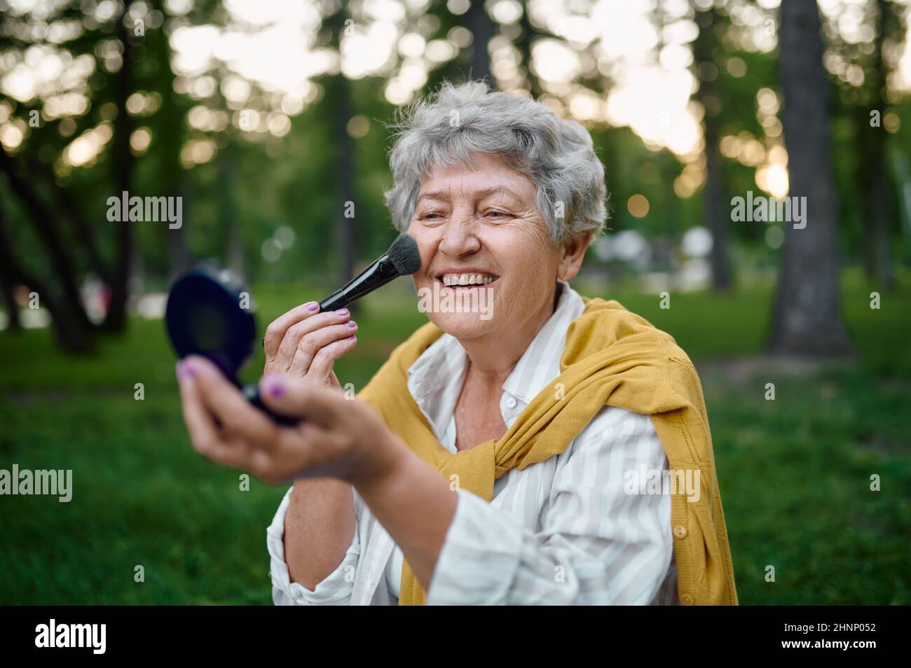 Pretty Granny Does Makeup In Summer Park Back To Youth Aged People