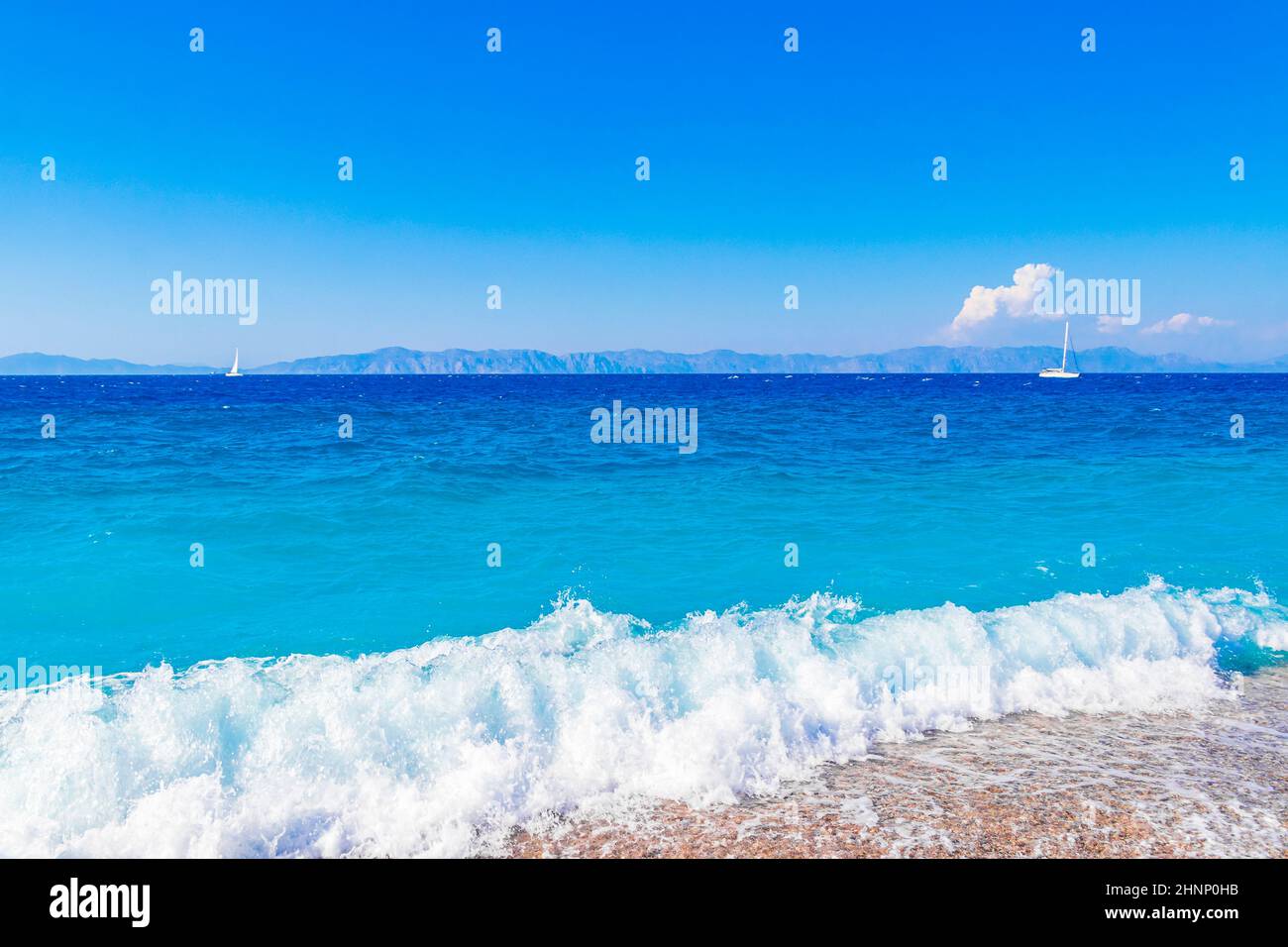 Elli beach coast landscape with turquoise clear water and view to ...