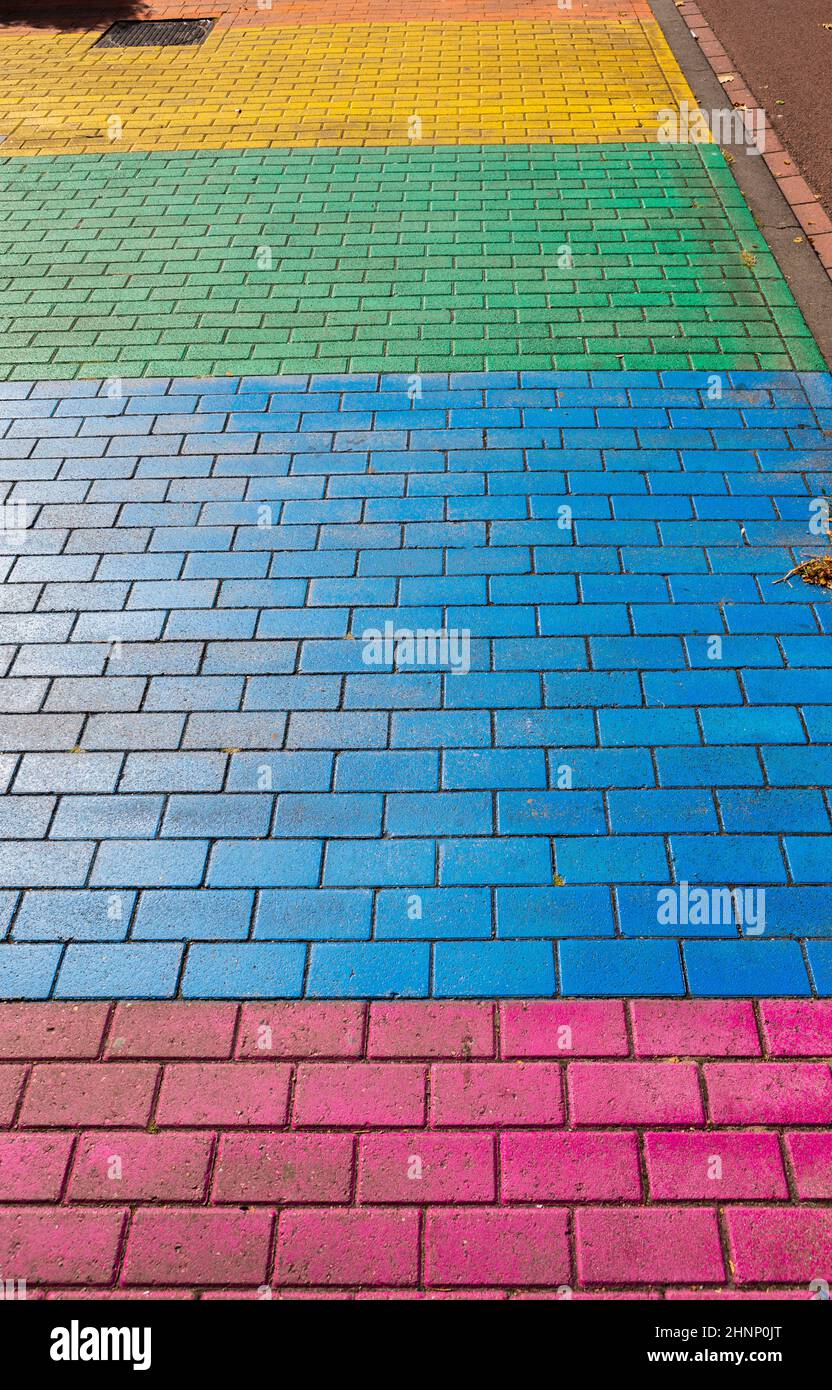 The photo shows a section of a sidewalk in rainbow colors Stock Photo ...