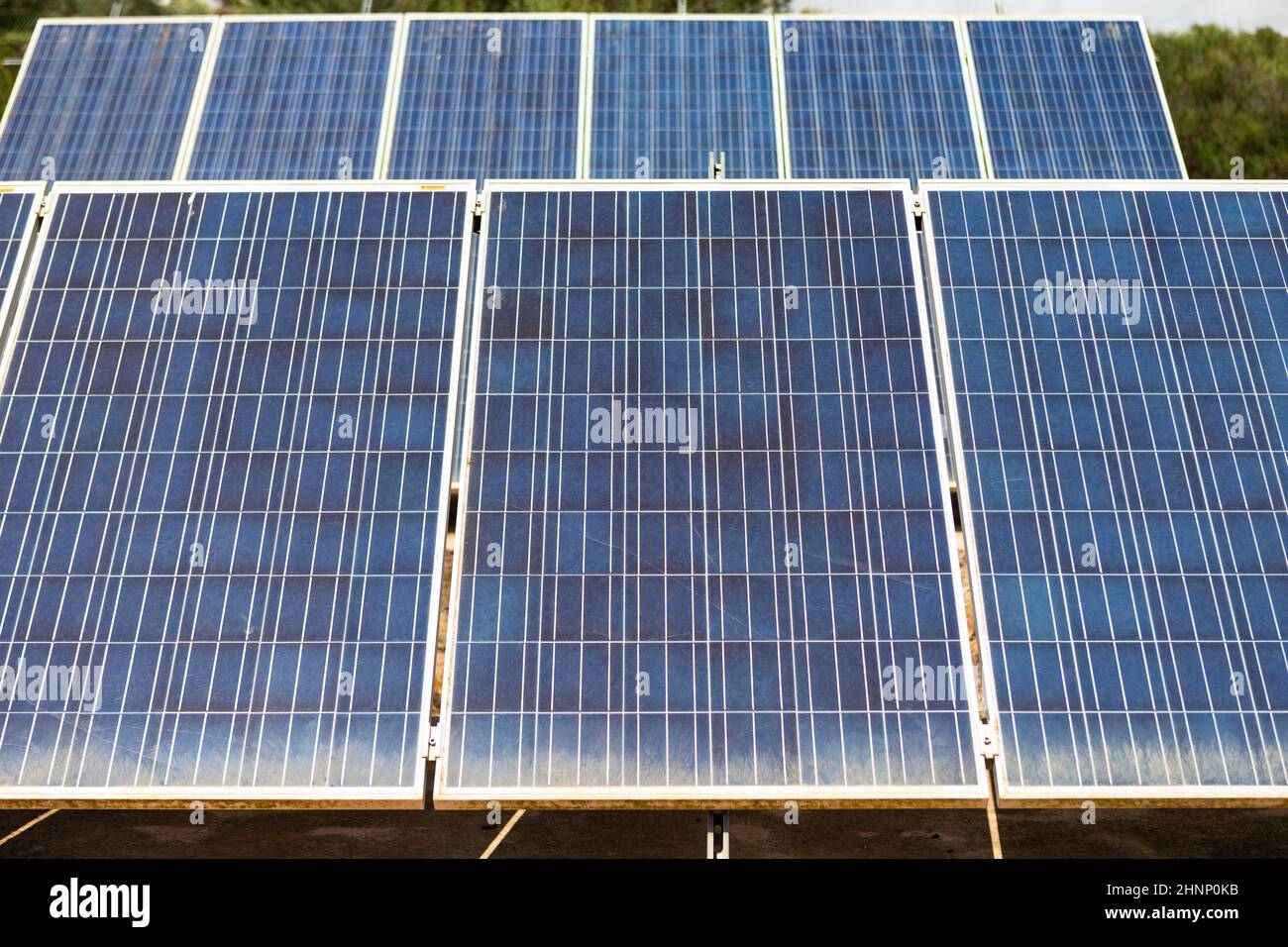 The photo shows several older solar panels in the sun Stock Photo - Alamy