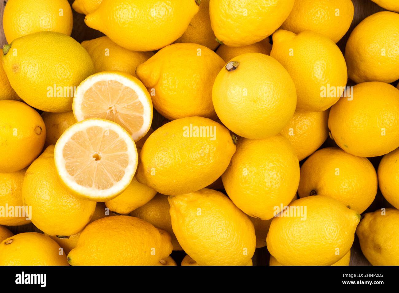 Yellow lemon fresh fruit as a background Stock Photo - Alamy