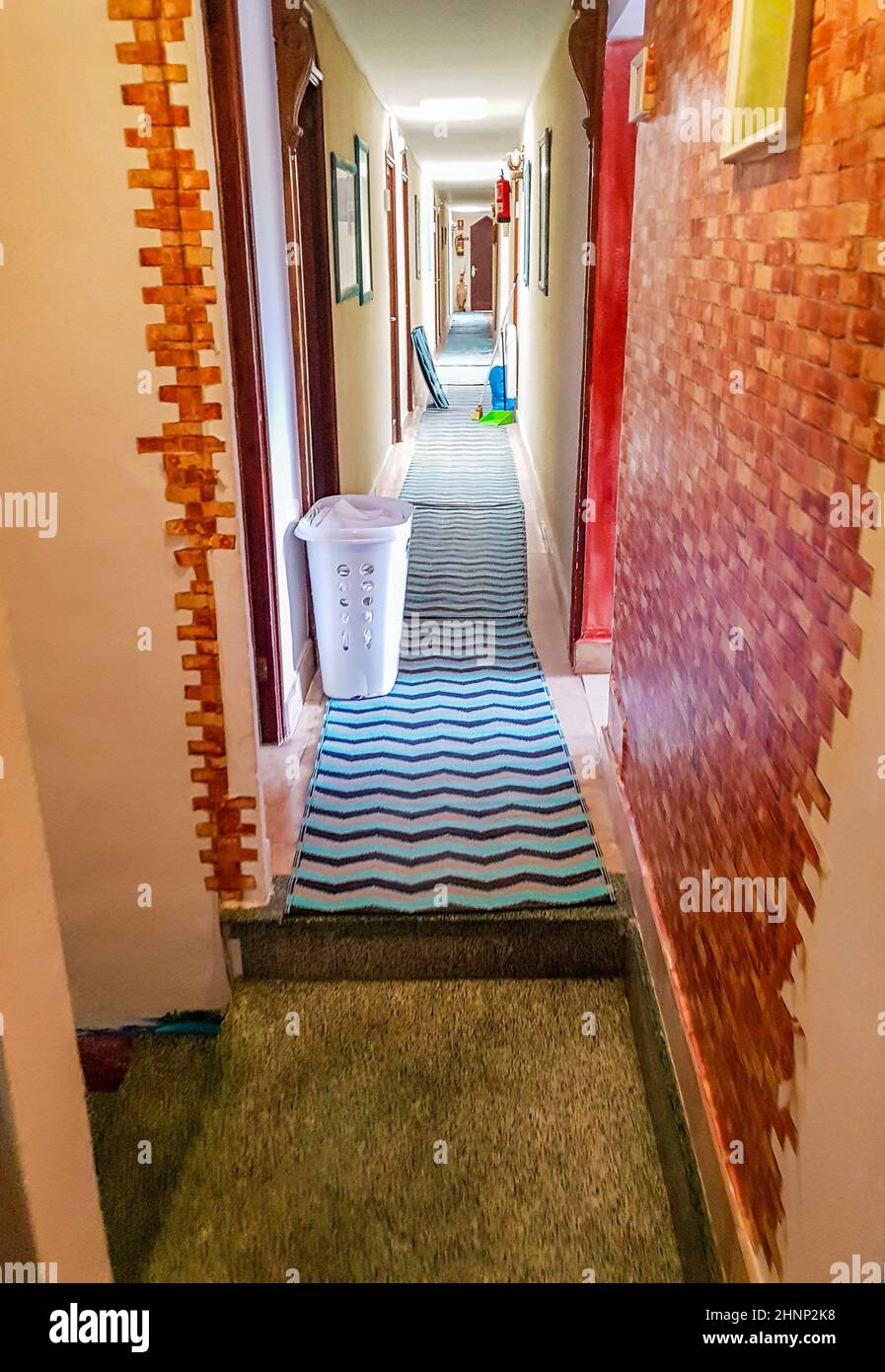 Red floor in the hotel hostel Cala Figuera Mallorca Stock Photo - Alamy