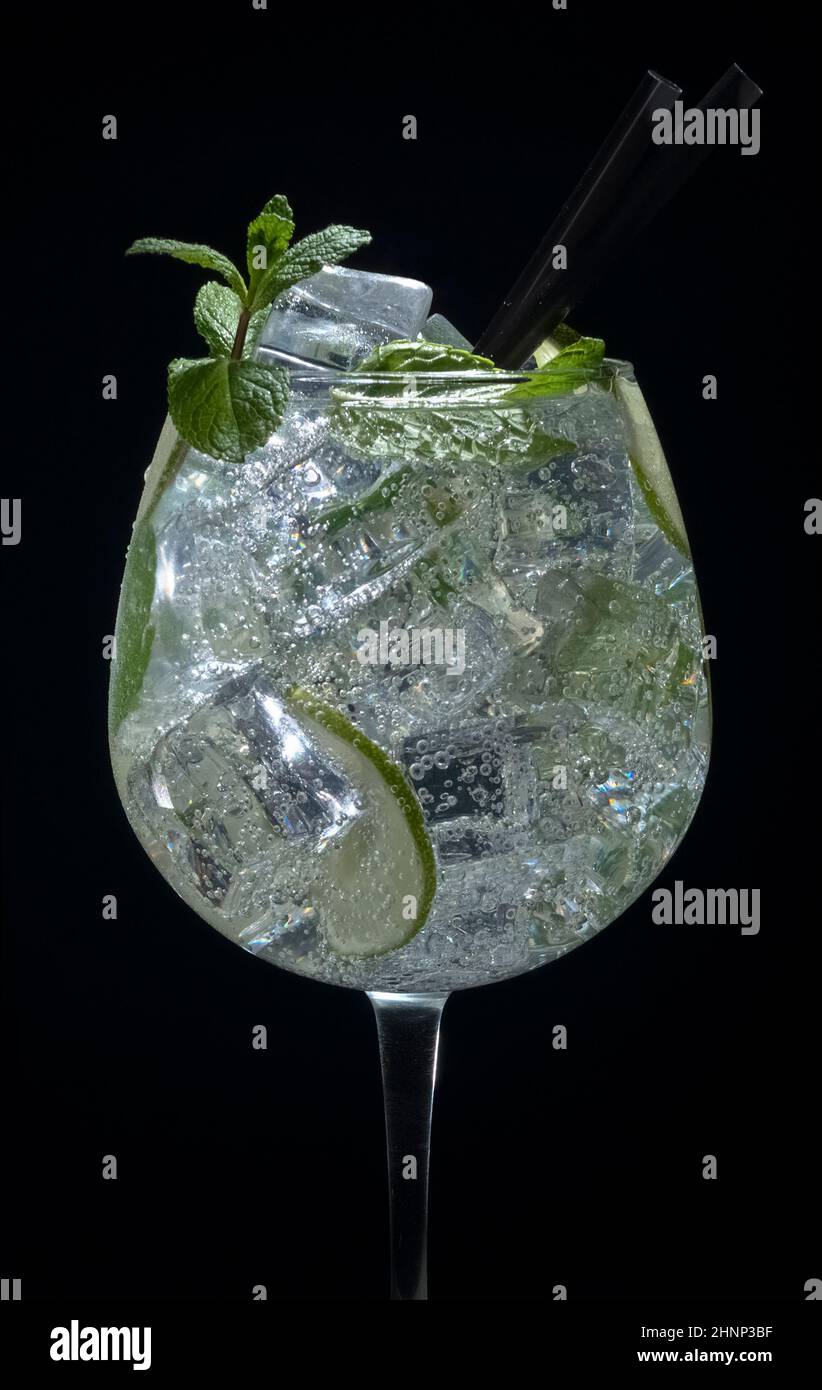 Luxury mojito in a large glass on a black background, an alcoholic ...