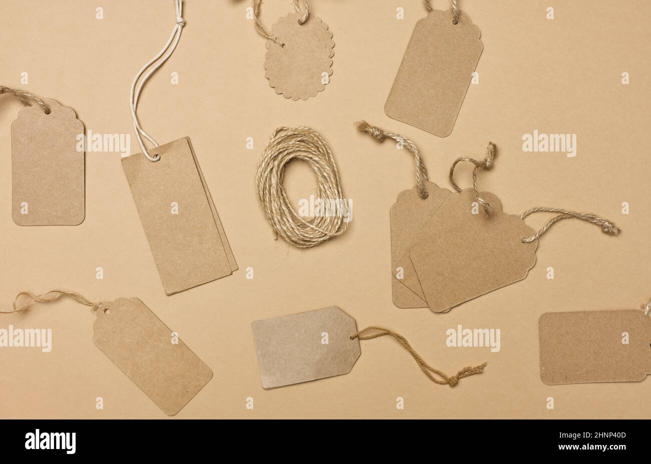 blank brown rectangular, round brown paper tag on a rope isolated on ...